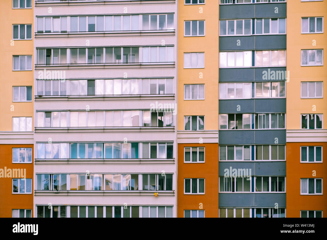 Closeup of residential high rise building façade with many windows ...