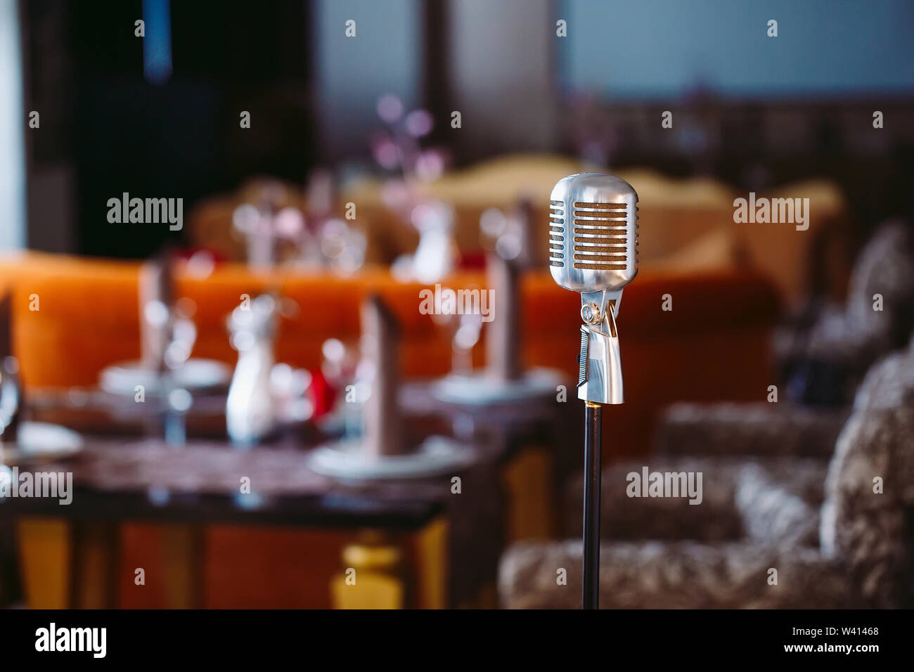 Retro karaoke microphone on a restaurant background Stock Photo - Alamy