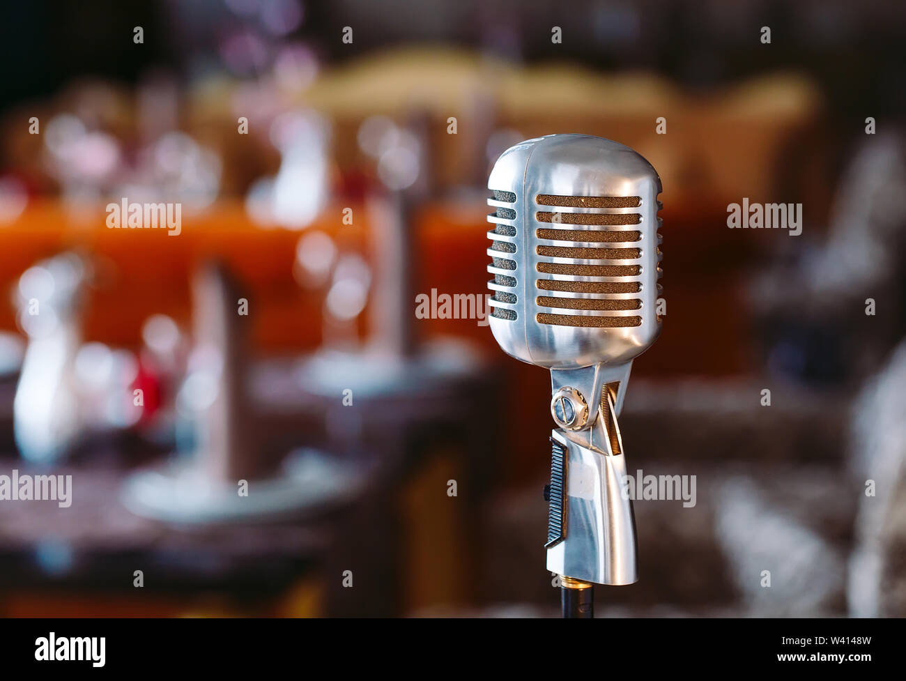 Retro karaoke microphone on a restaurant background Stock Photo - Alamy