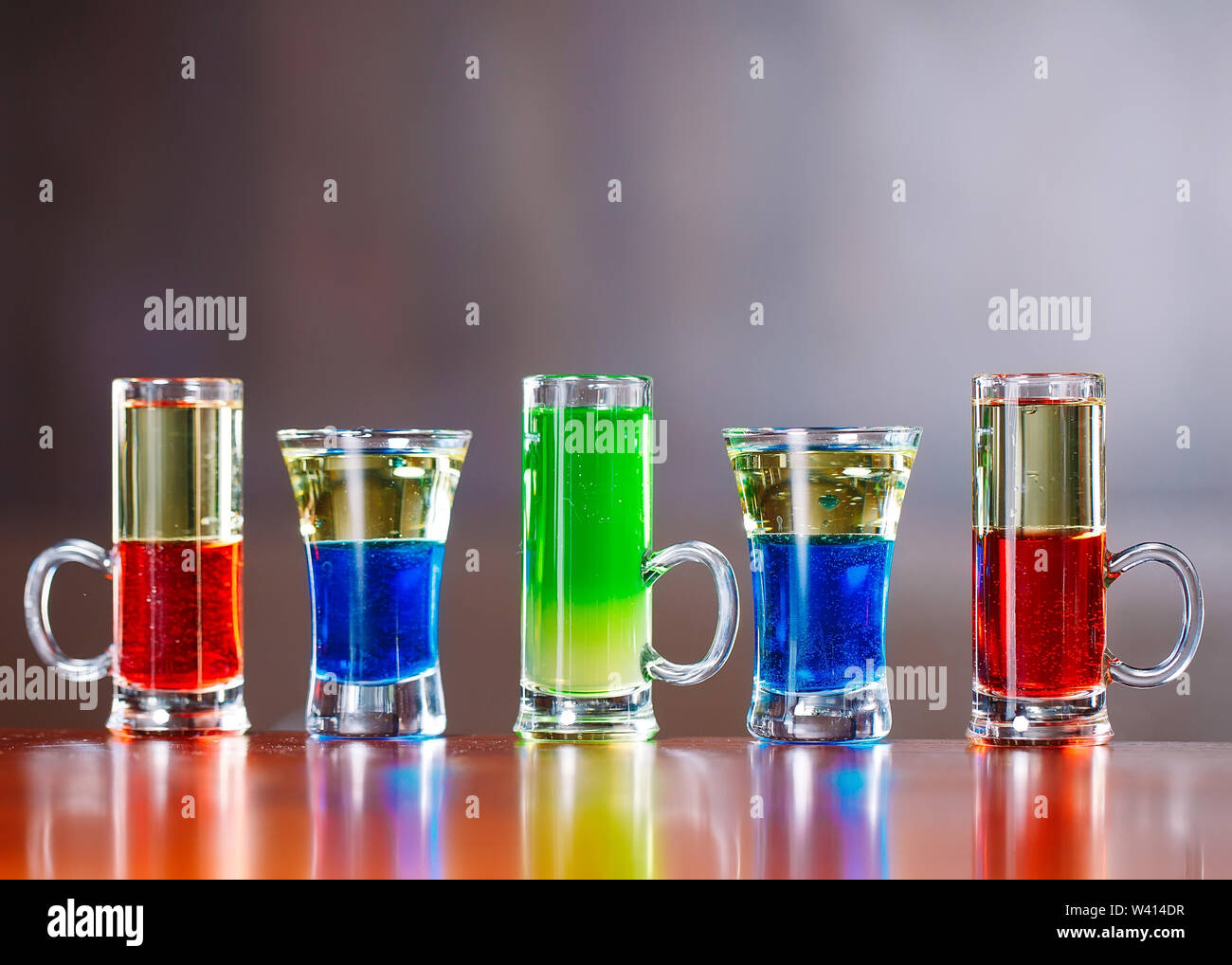 Shots on bar. colorful cocktails on bar counter Stock Photo - Alamy