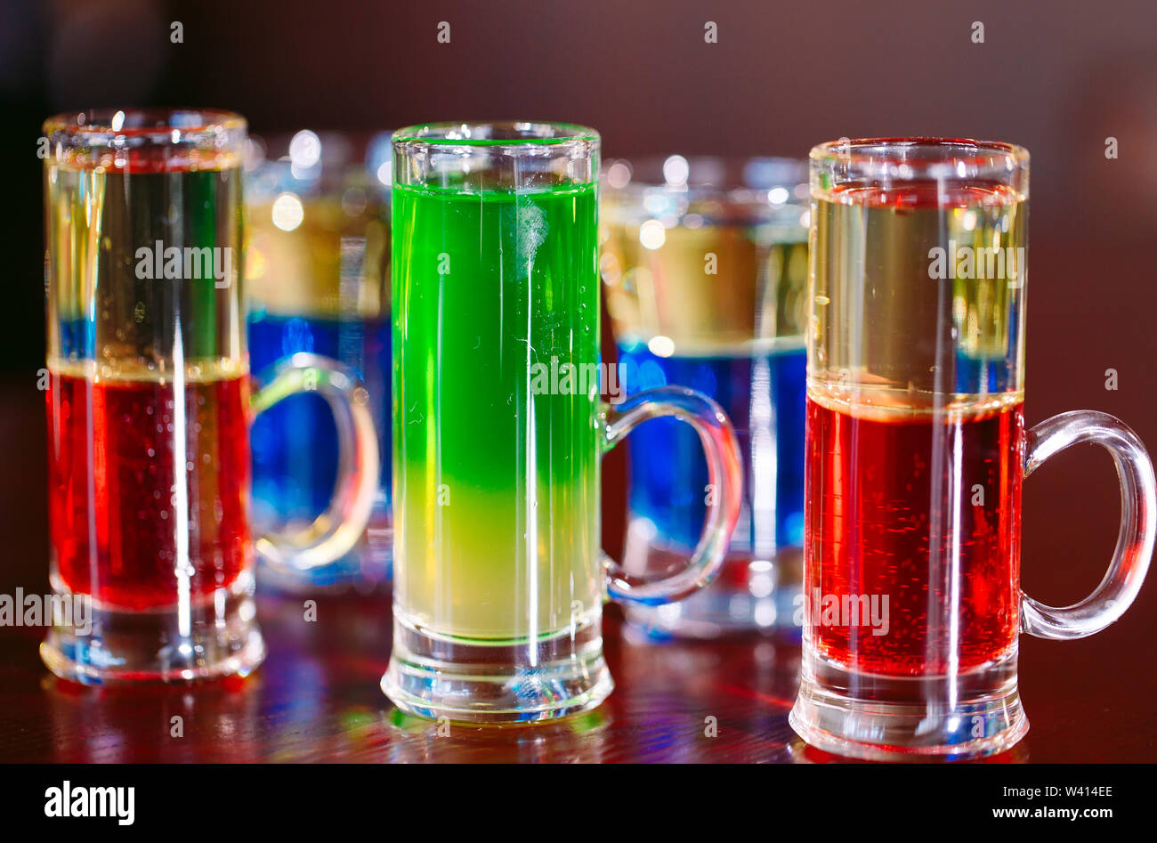 Shots on bar. colorful cocktails on bar counter Stock Photo - Alamy
