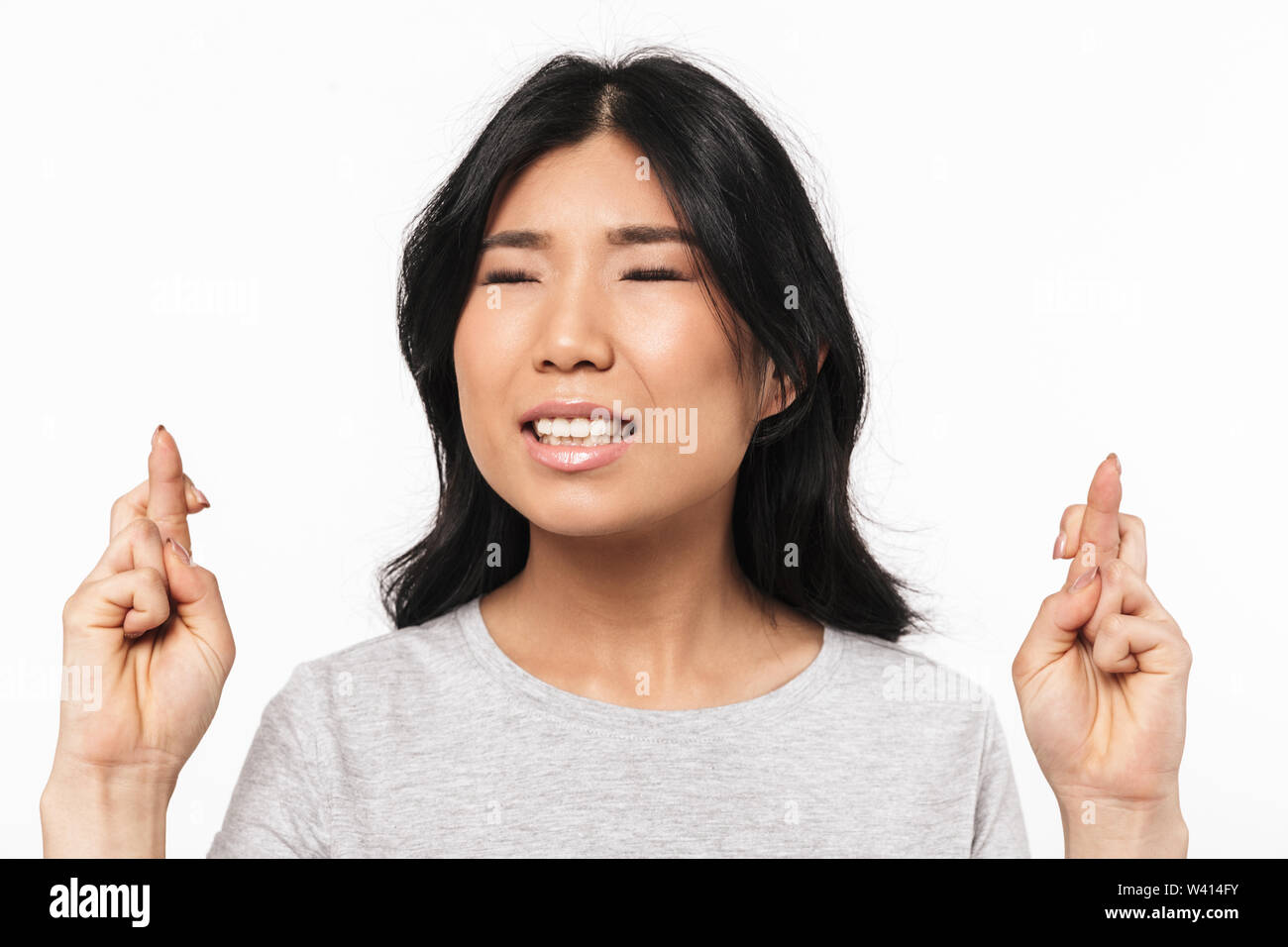 Image of asian nervous beautiful young woman posing isolated over white ...
