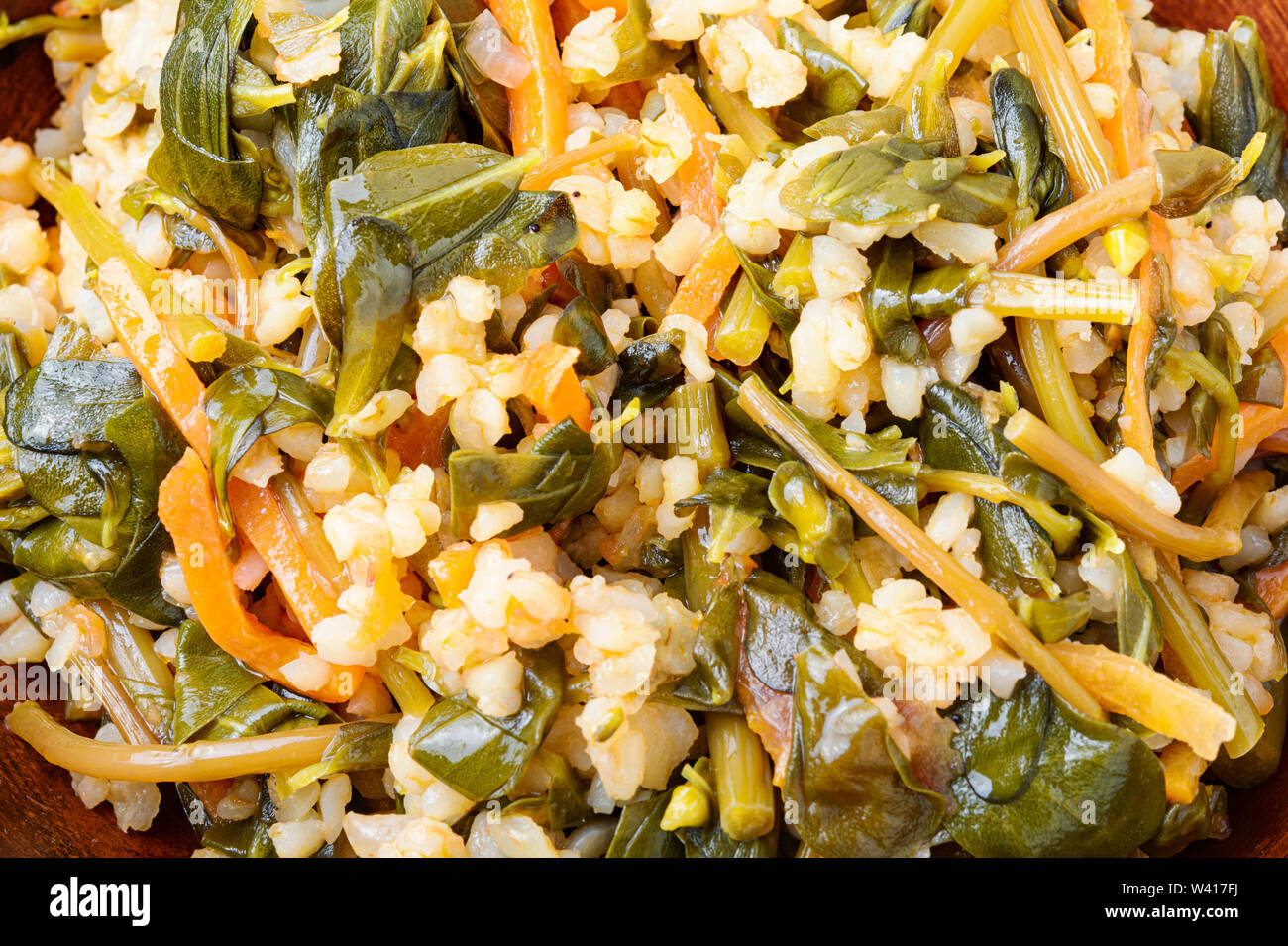 Popular food of the Middle East.Stew bulgur.Bulgur with portulak Stock ...