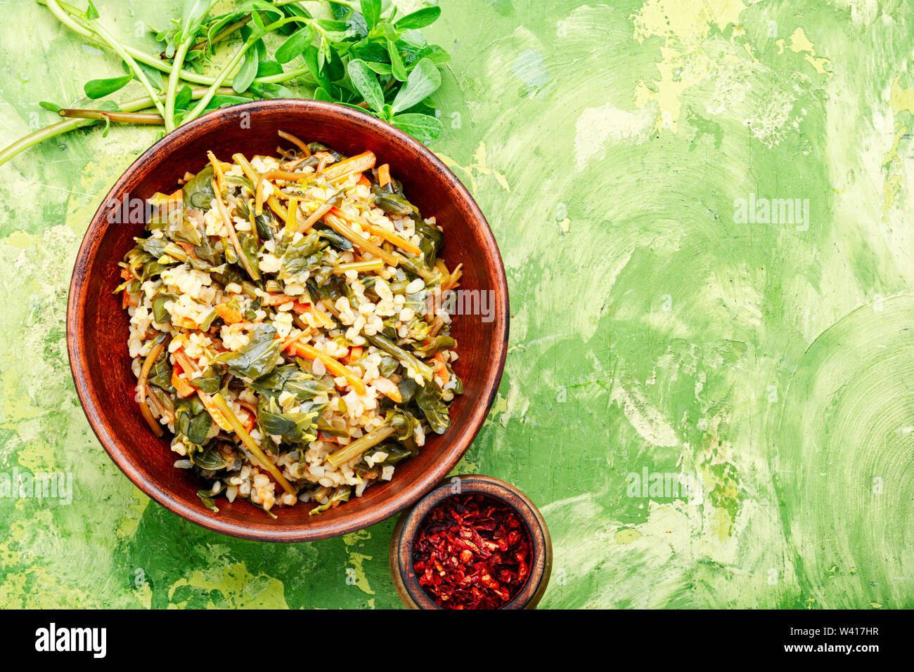 Popular food of the Middle East.Stew bulgur.Bulgur with portulak Stock ...