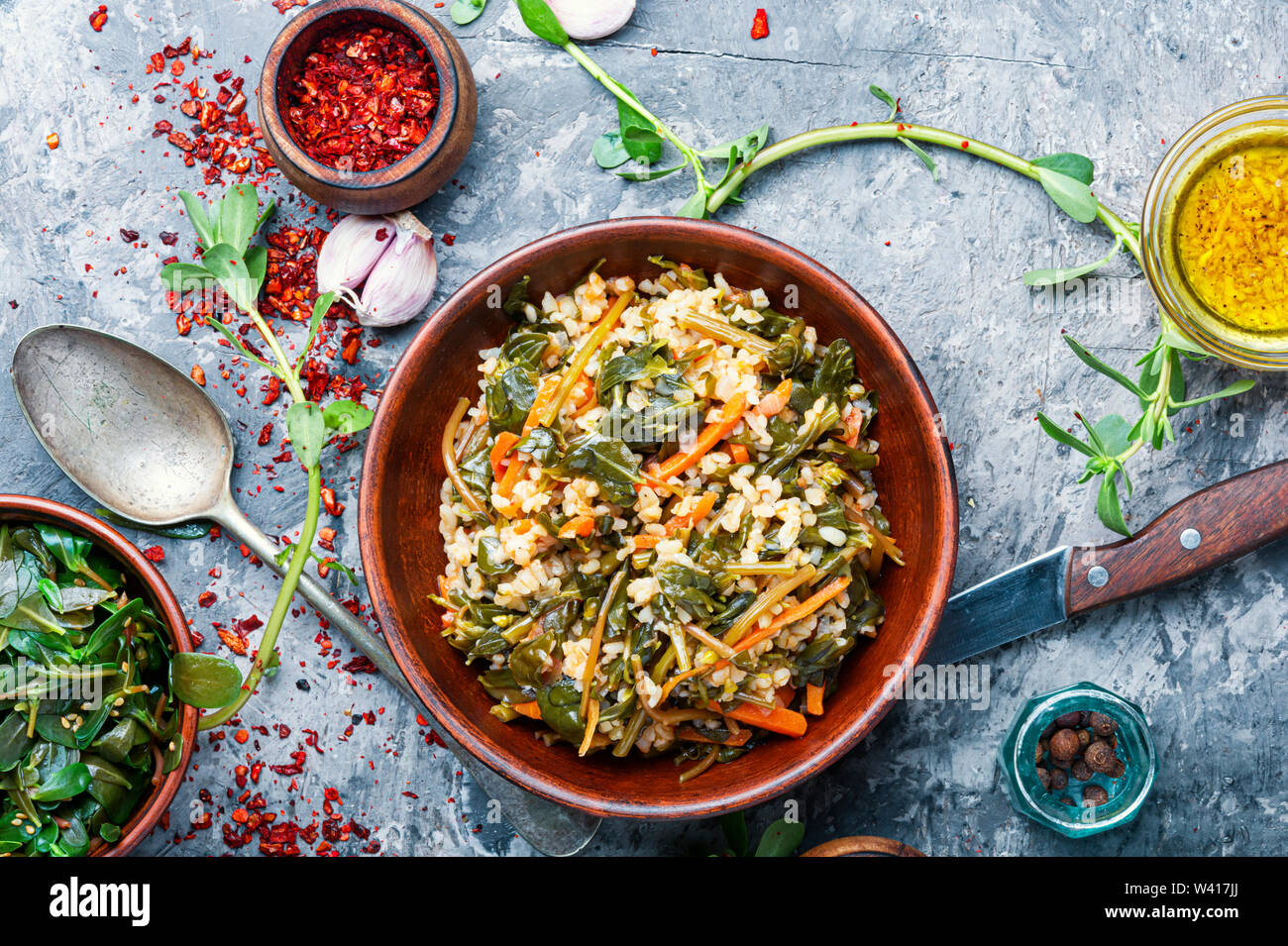 Popular food of the Middle East.Stew bulgur.Bulgur with portulak Stock ...