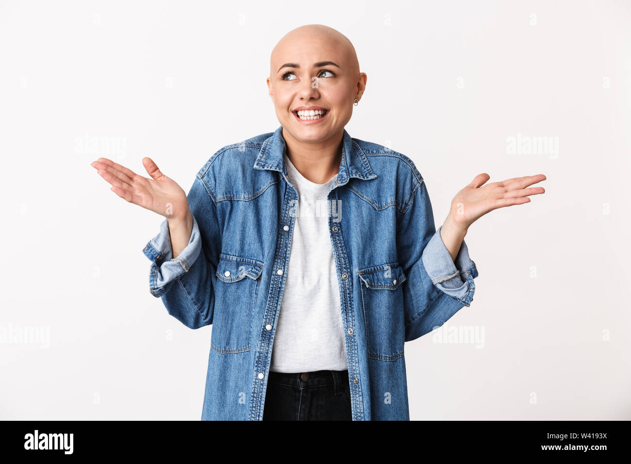 Portrait of a beautiful excited young hairless woman wearing casual ...