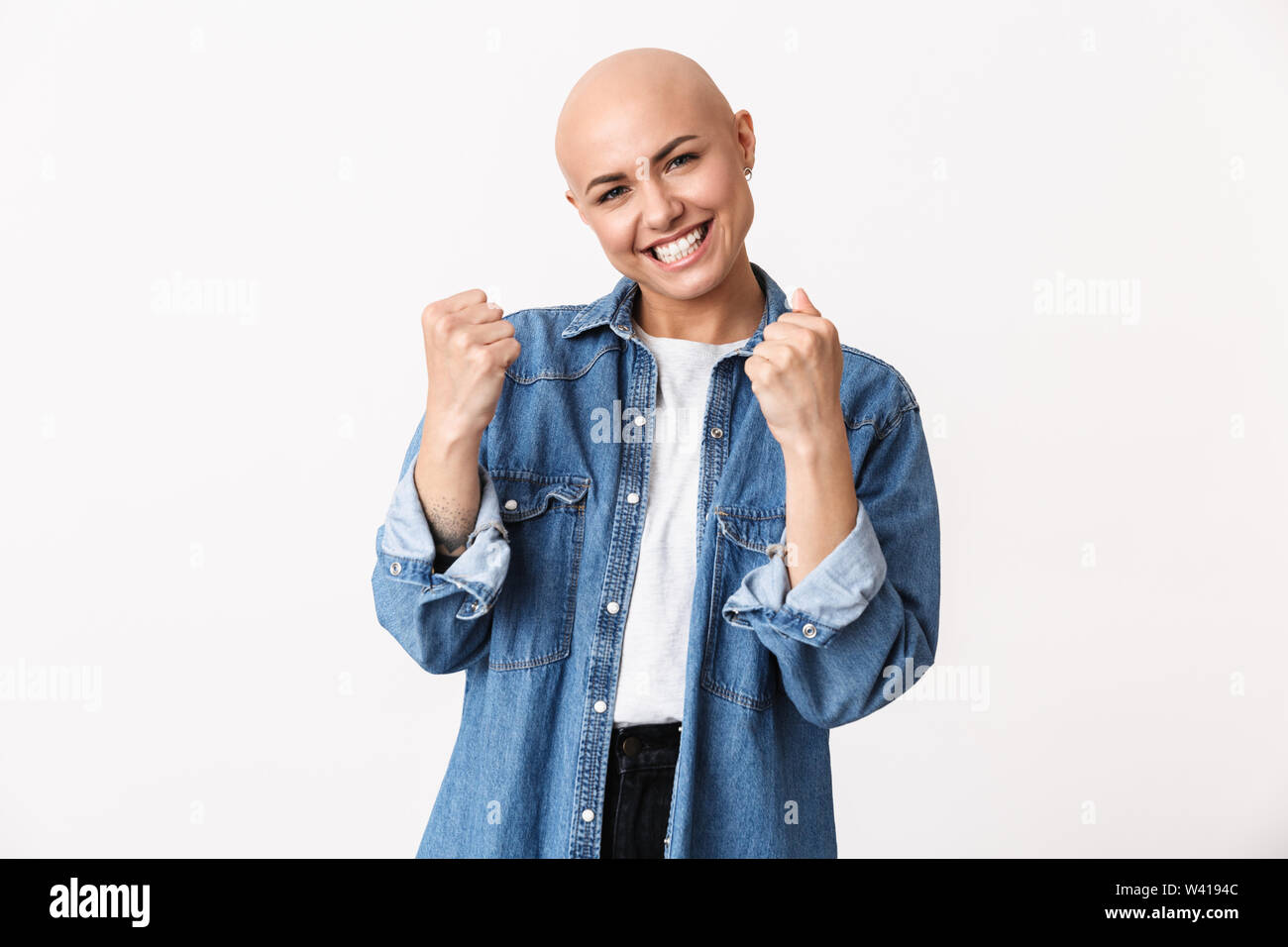 Portrait of a beautiful young hairless woman wearing casual clothes ...