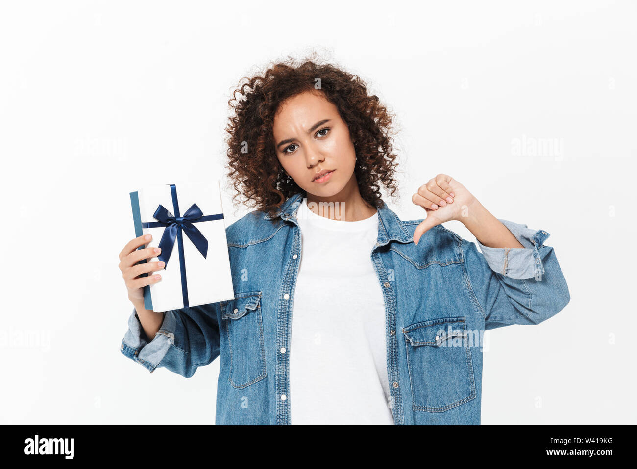 Image of a beautiful displeased young african woman posing isolated ...