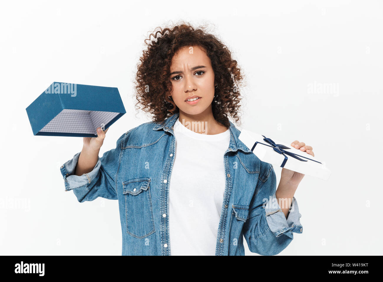 Image of a beautiful displeased young african woman posing isolated ...