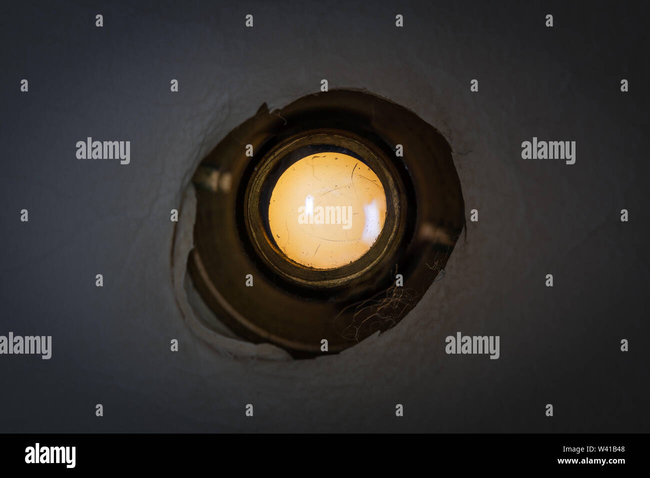 Looking through peephole hi-res stock photography and images - Alamy
