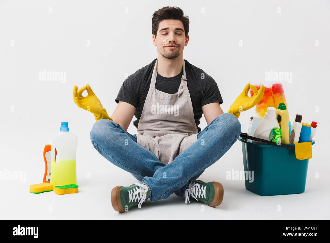 Image of a concentrated young houseman househusband with cleansers on ...