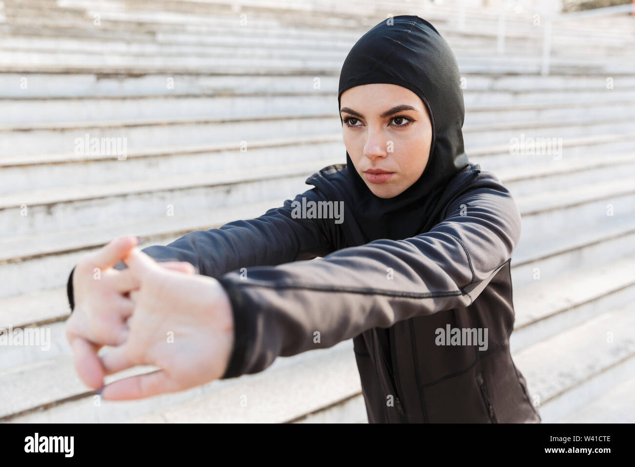 Picture of a young serious muslim sports fitness woman dressed in hijab ...