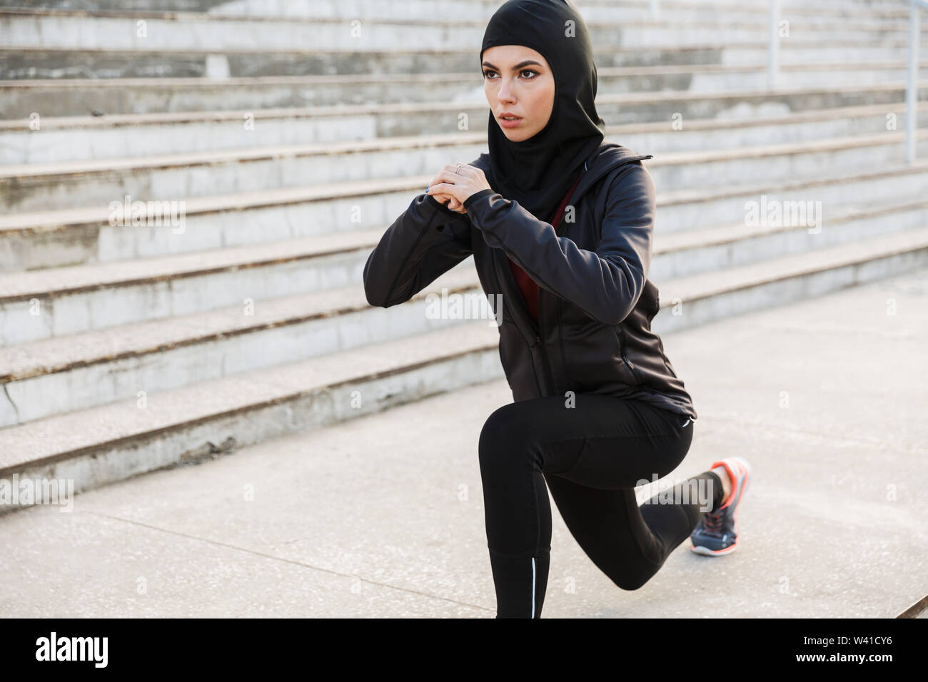 Picture of a young serious muslim sports fitness woman dressed in hijab ...