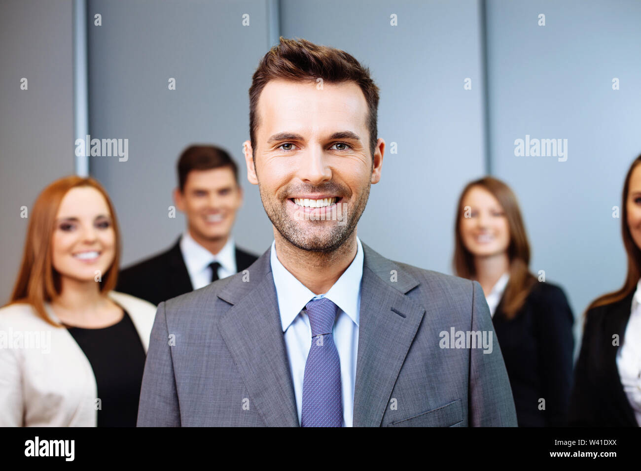 Group of business people smiling leader hi-res stock photography and ...