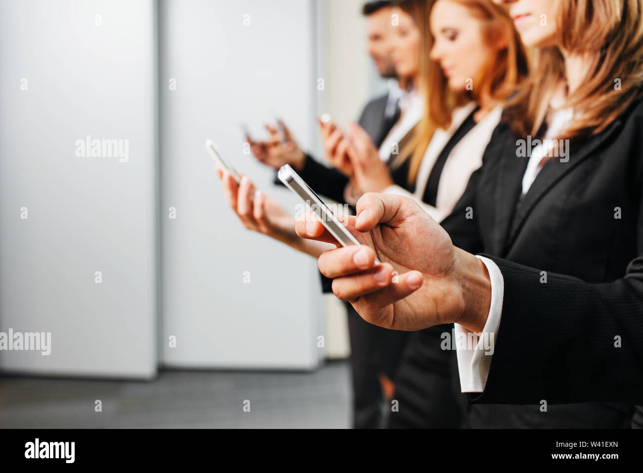 Business group smartphone hand hi-res stock photography and images - Alamy