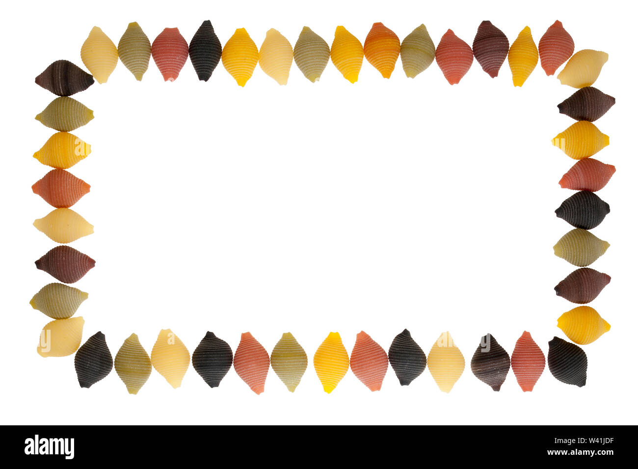 Decorative frame from five color shell pasta, isolated on white ...