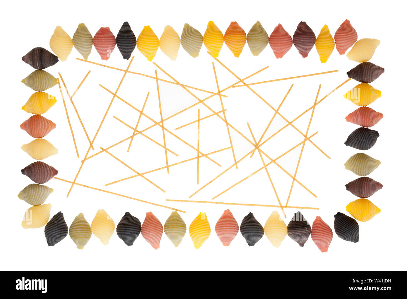 Decorative frame of five color shell pasta and wholemeal spaghetti ...