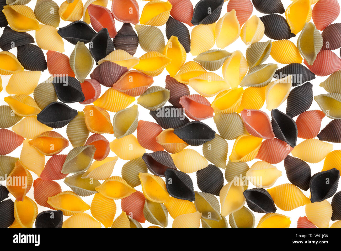 Five color shell pasta, isolated on white background Stock Photo - Alamy