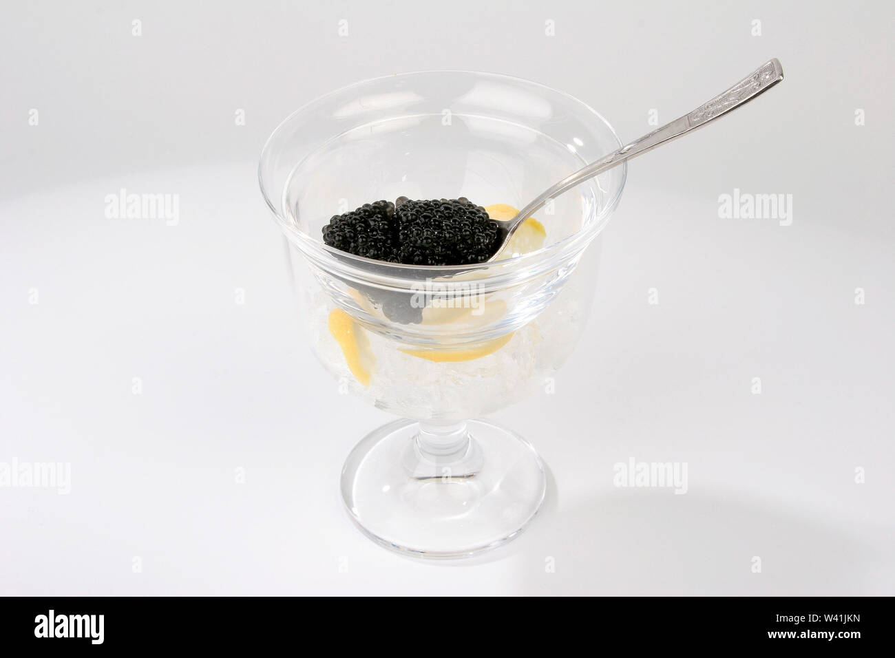 Caviar with spoon and lemon isolated on white Stock Photo - Alamy