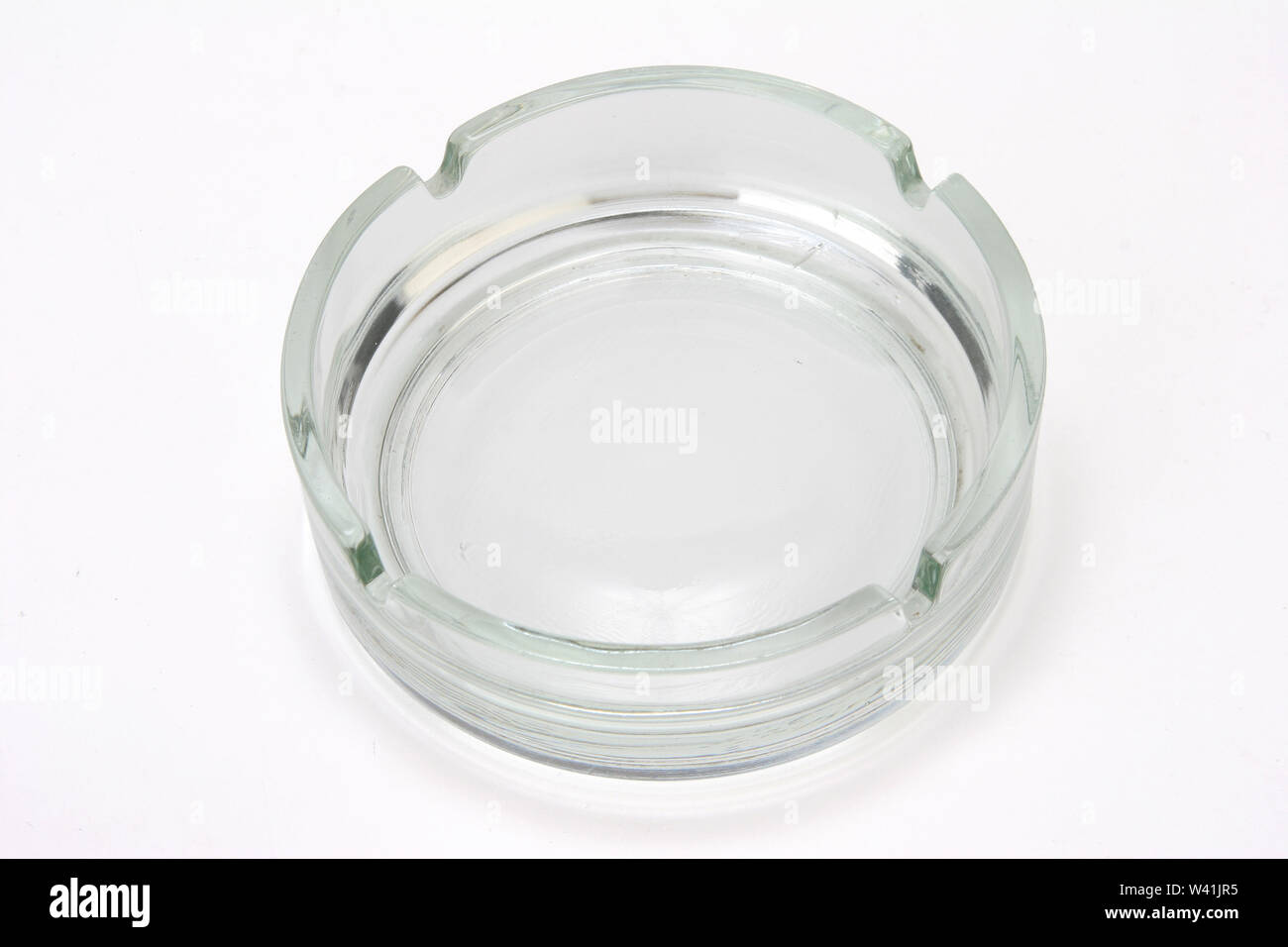 Glass empty ashtray isolated on white background Stock Photo - Alamy