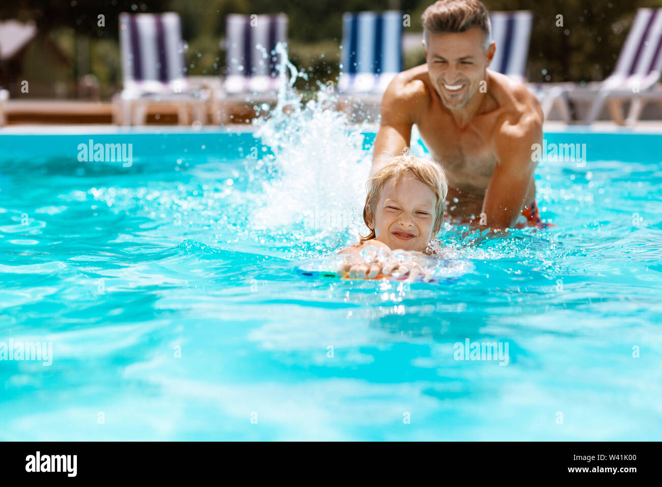Teaching their son to swim hi-res stock photography and images - Alamy