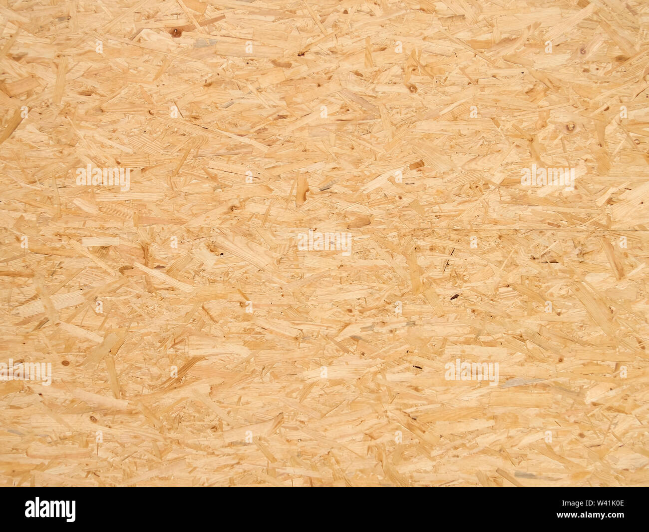 Pressed wooden panel background, seamless texture of oriented strand ...