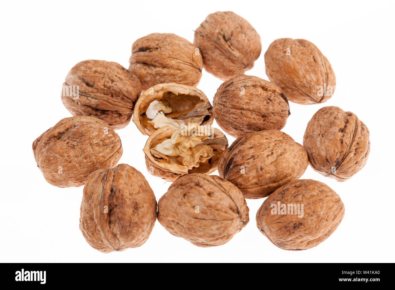 Walnuts in shell isolated on white background Stock Photo - Alamy