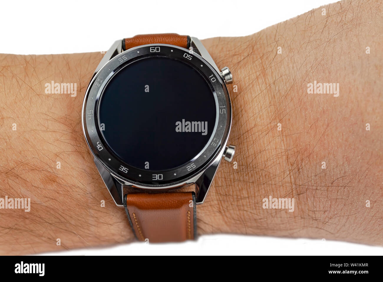 Smart watch worn on the hand, close-up on a white background. Isolate ...