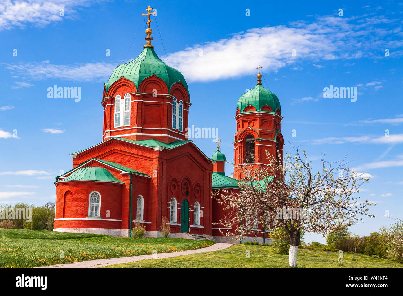 The Orthodox Church with an Apple tree Stock Photo - Alamy