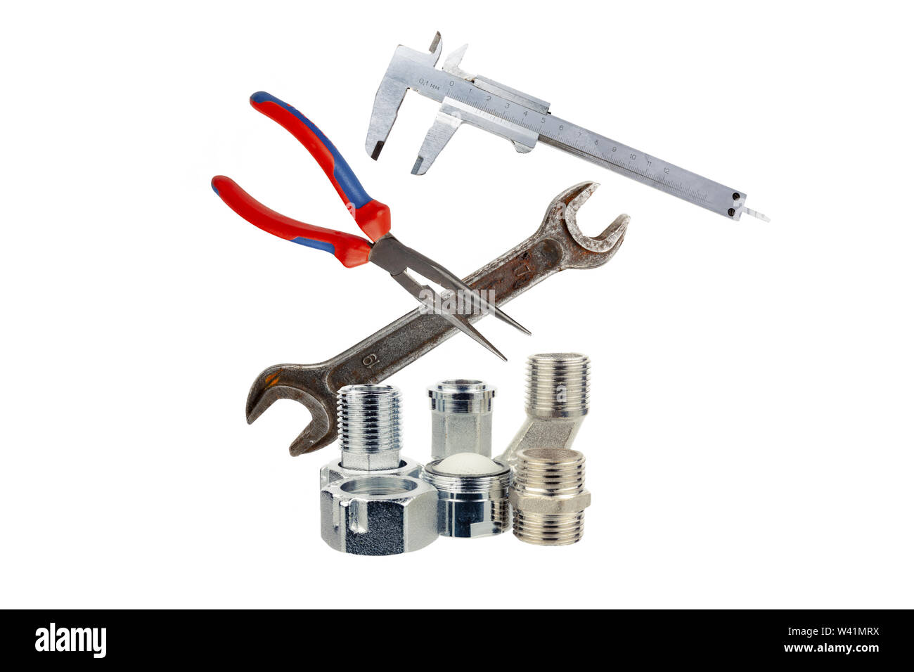 Metal adapters for water supply with the tool on a white background ...