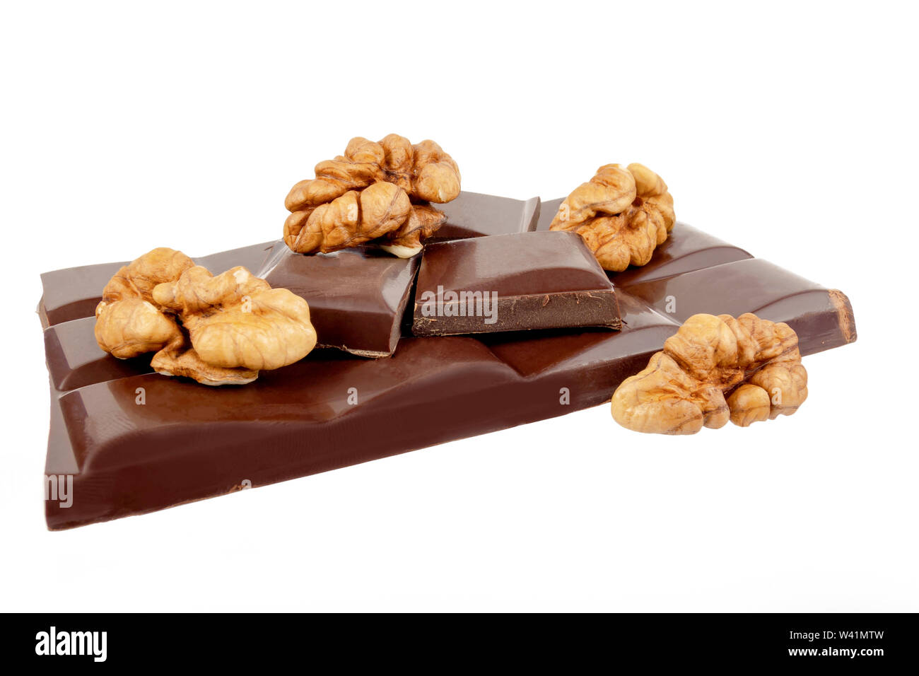 dark chocolate bar with walnuts on a white background Stock Photo - Alamy