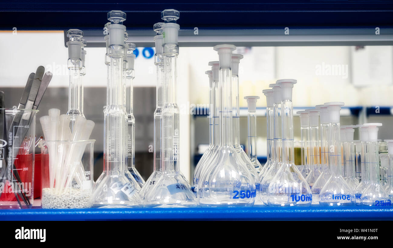 Laboratory tubes of various sizes are on the shelf Stock Photo - Alamy