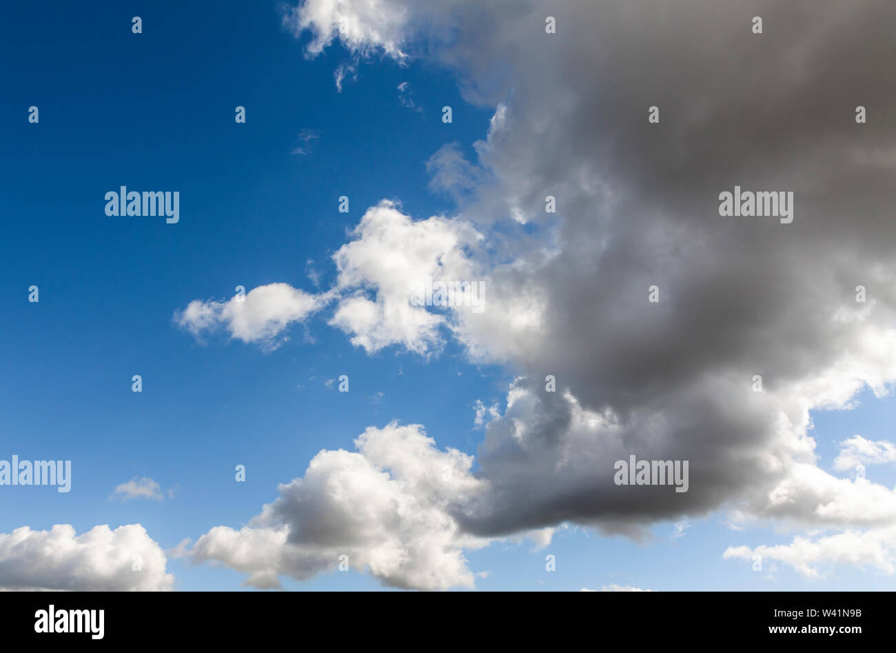 Summer blue sky with rain clouds closeup Stock Photo - Alamy