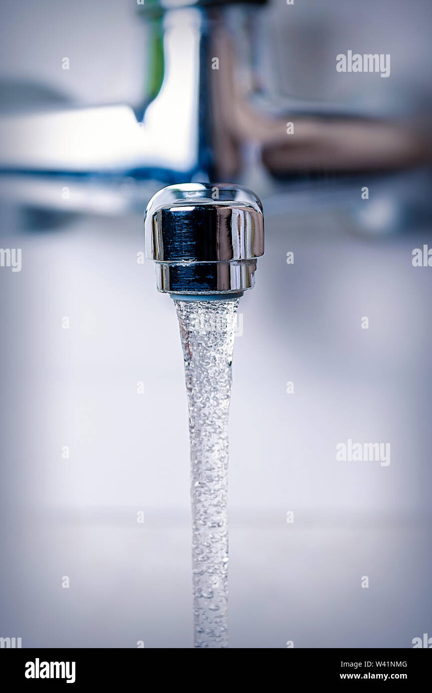 Water flows from kitchen faucet hi-res stock photography and images - Alamy