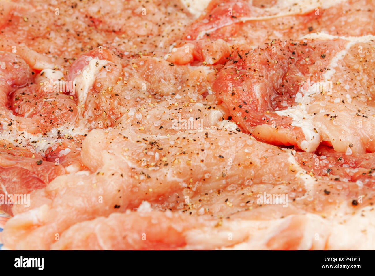 Fresh sliced meat with crushed pepper close-up. Pickling Stock Photo ...