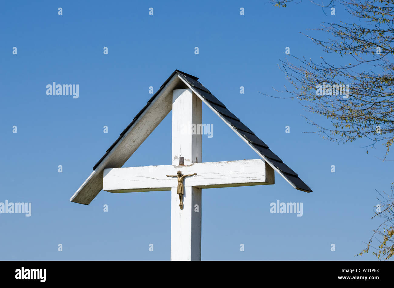 Wooden cross with Jesus figure in the countryside, Bavaria, Germany ...