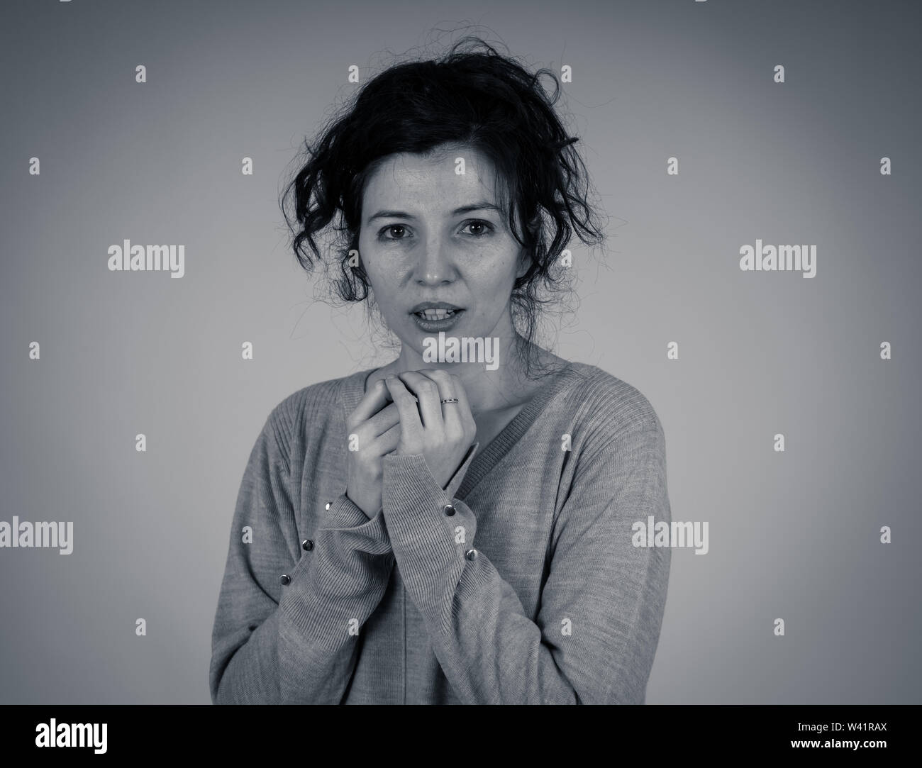 Close up portrait in black and white of young scared and frightened ...