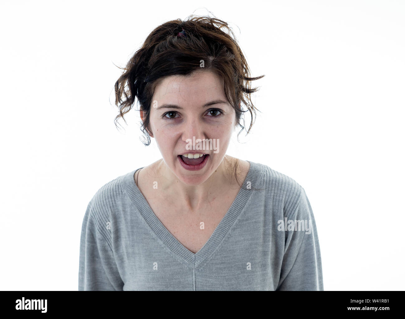 Close up of young attractive caucasian woman with an angry face ...