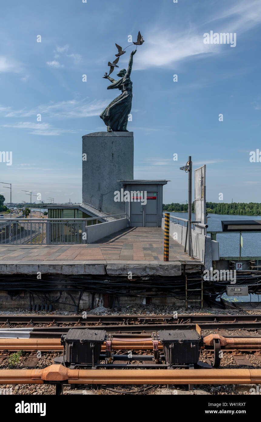 Two Soviet-era statues called the Young Pioneers stand on top of two ...