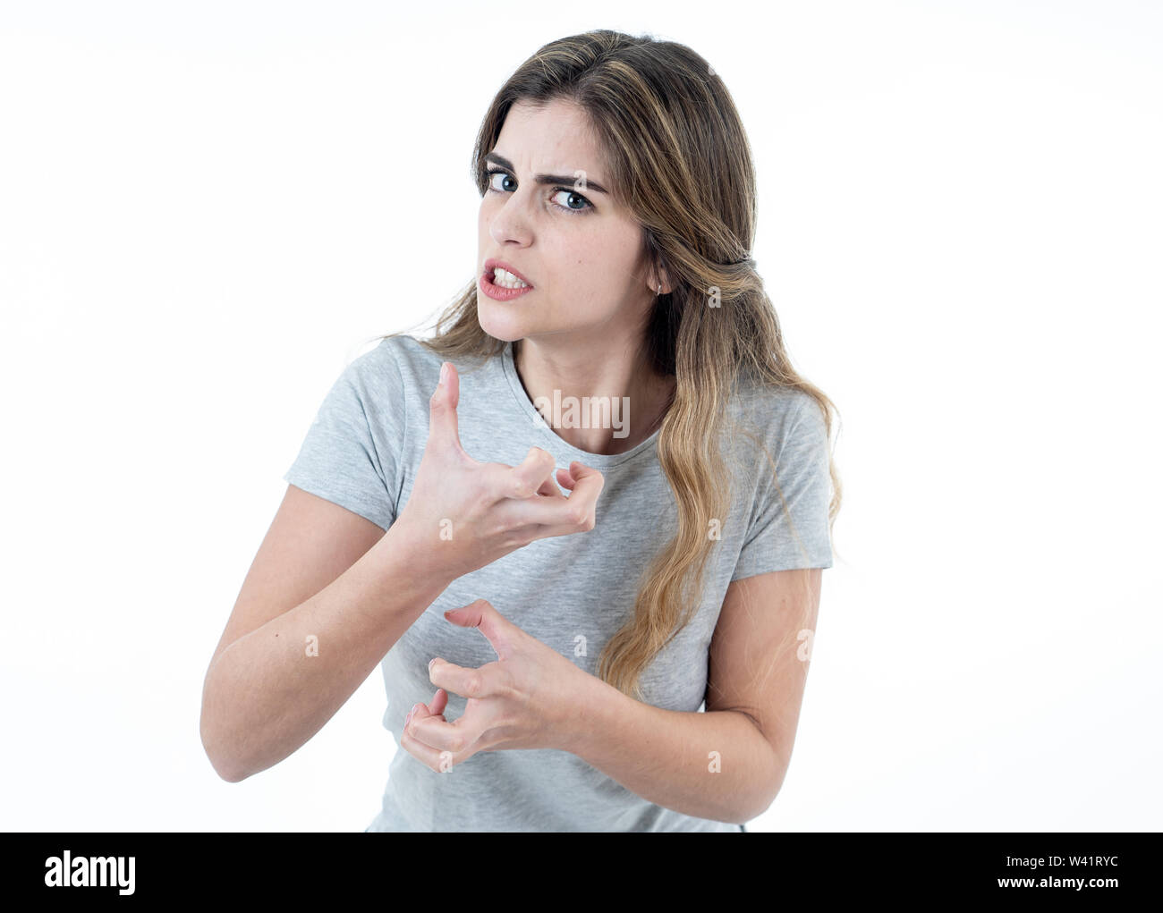 Close up of young attractive caucasian woman with an angry face ...