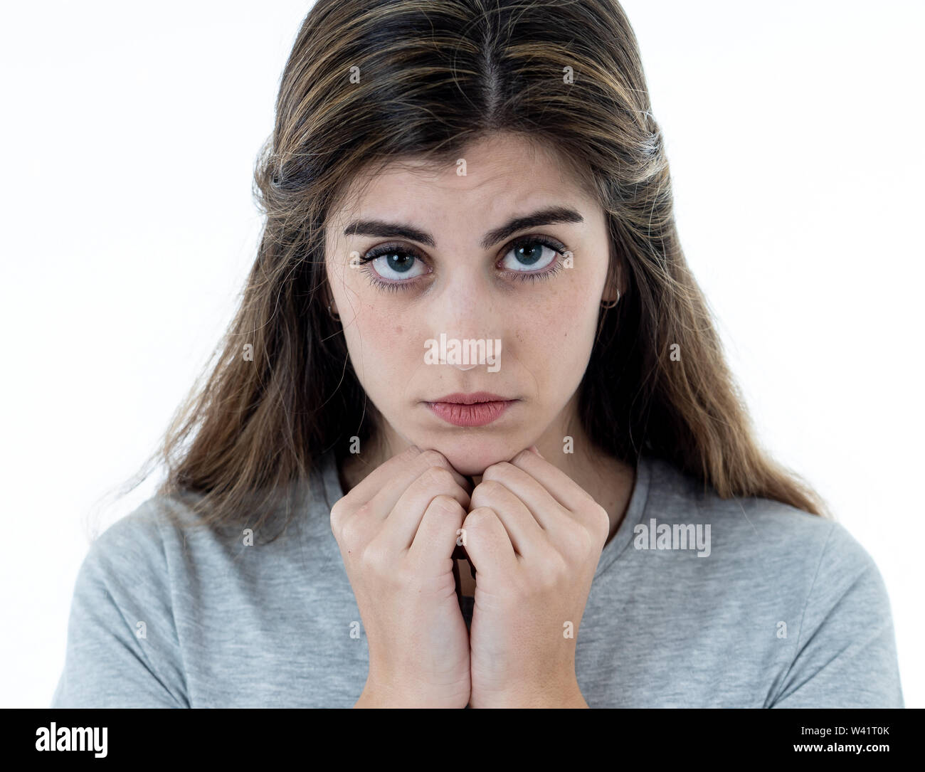 Portrait of young sad woman, serious and concerned crying and feeling ...