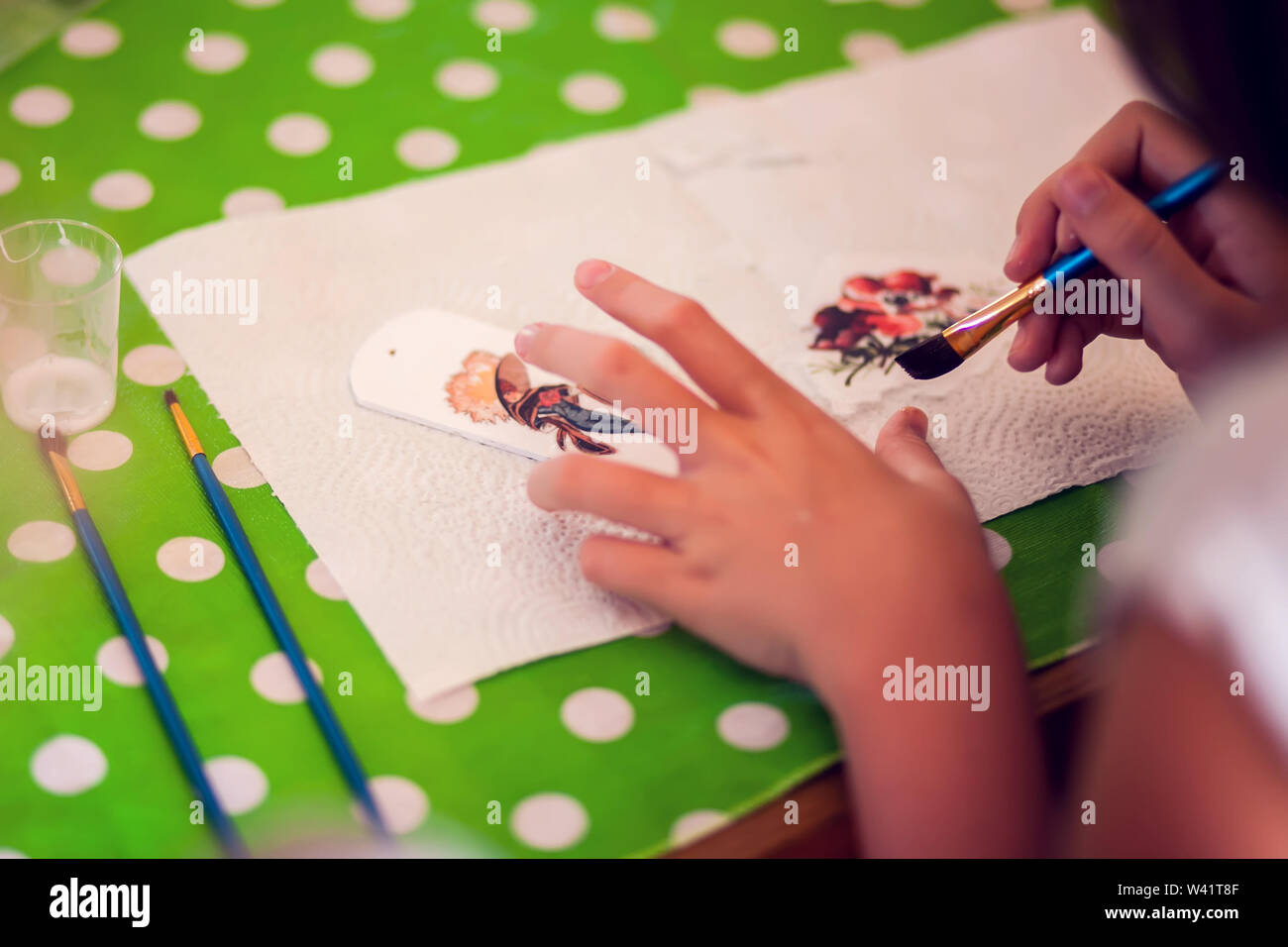 Children hands making artworks with wood and paint crafts. workplace ...
