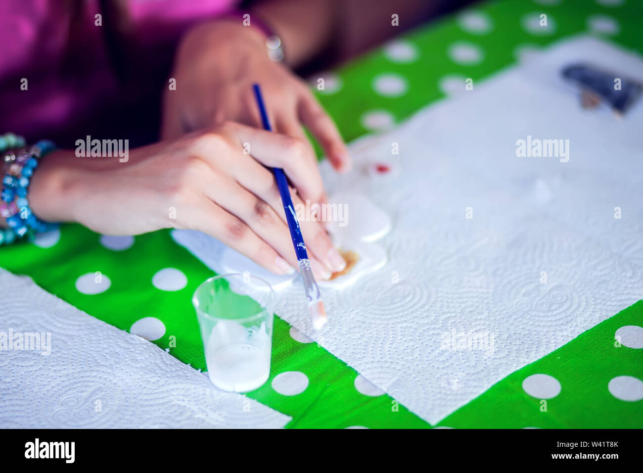 Children hands making artworks with wood and paint crafts. workplace ...