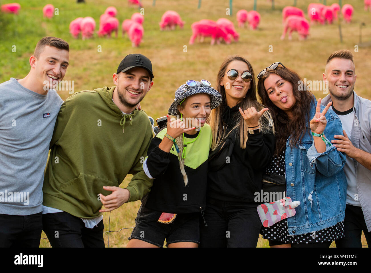 Henham Park, Suffolk, 18 July 2019. Selfies by the Latitude sign and ...