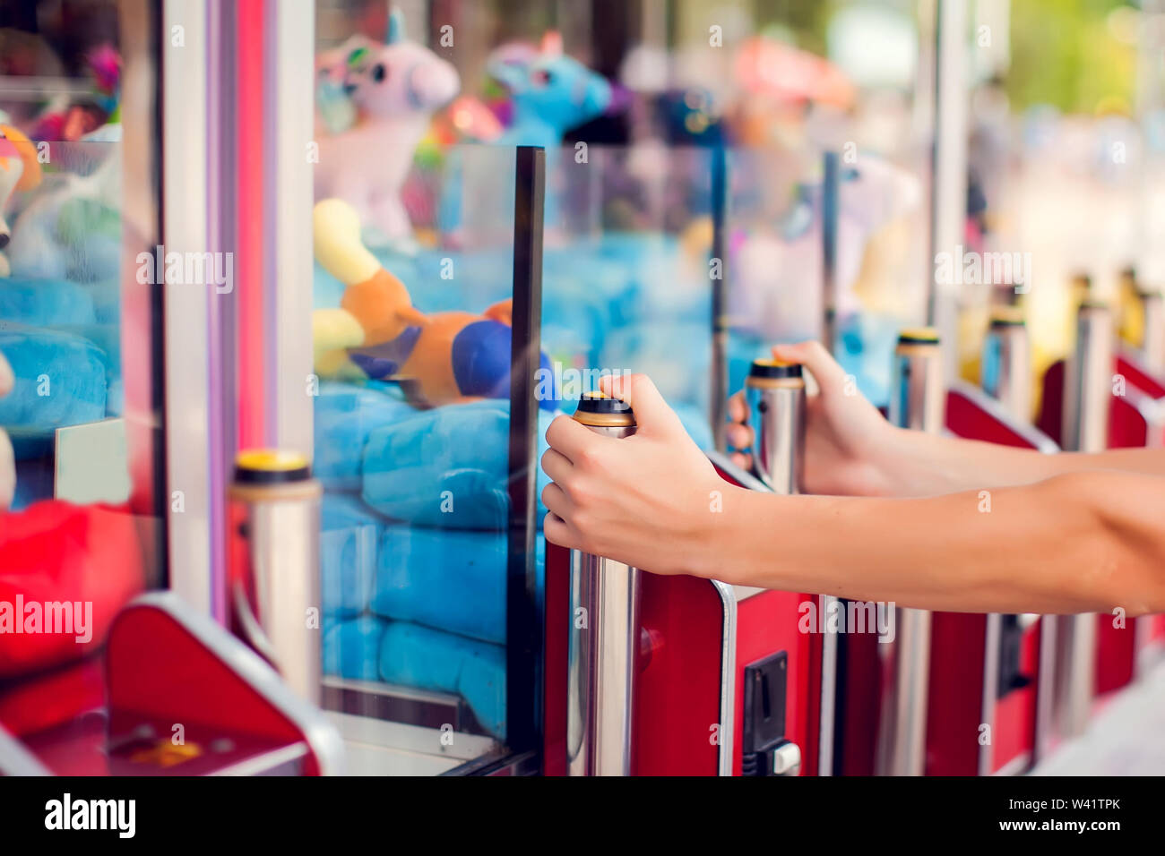Claw machine in the amusement park of the mall which insert coin and ...