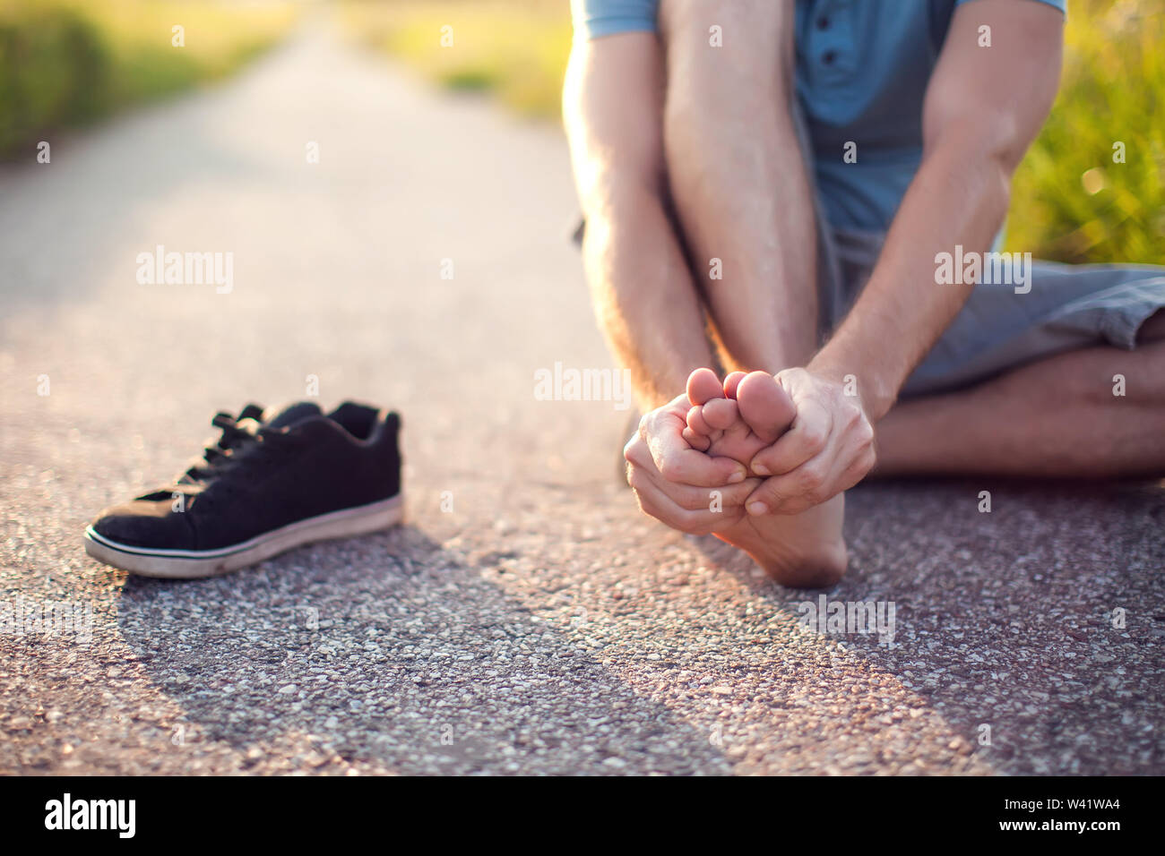 Man painful feet hi-res stock photography and images - Alamy