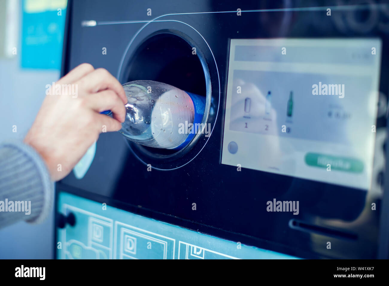 Shoppers return their bottles and cans of reusable packagings in a ...