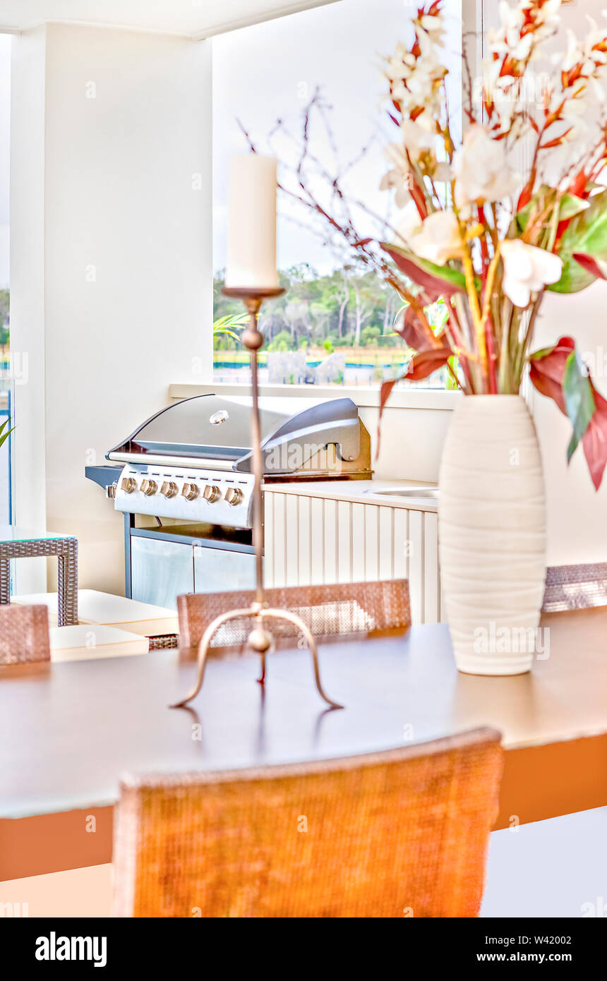 Perfect lightning, flower pot close up and furnitures near lake ...