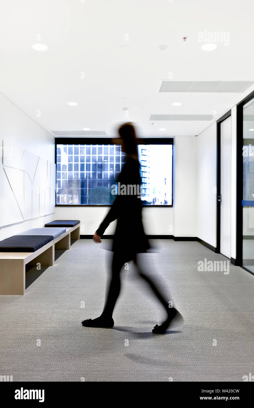 Person in the modern waiting room and blurred action photo given by the ...