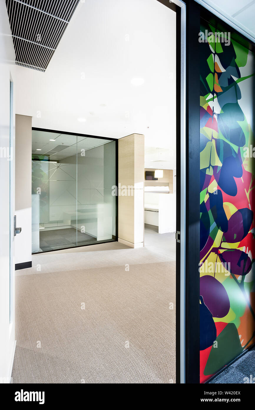 Entrance to a modern building with nice wall art and door post Stock ...